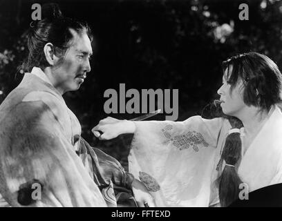 RASHOMON, 1950. /nMasayuki Mori (left) and Machiko Kyo in a scene from ...