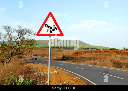 Indian road cautionary sign indicating dual carriageway is ending and a ...