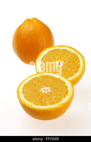 Fresh orange cut into two pieces Stock Photo - Alamy