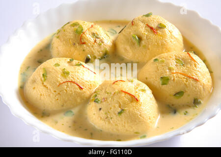Indian sweet, kesar rasmalai garnish with pistachio and saffron served ...