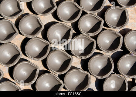Oil lamps made of mud drying Stock Photo - Alamy
