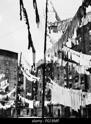 NEW YORK CITY: CLOTHESLINE. /nClotheslines hanging between apartment ...