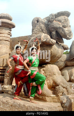 Dancers performing classical traditional odissi dance in front of bay of Bengal sea , Konarak ...
