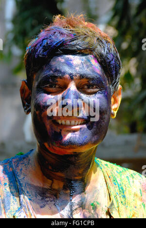 Coloured face of man enjoying holi festival MR#364 Stock Photo - Alamy