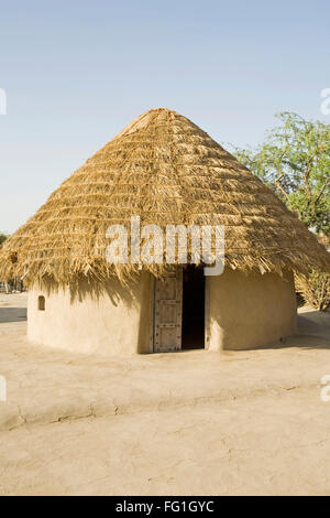 Bhunga traditional circular house with mud walls and thatched conical ...