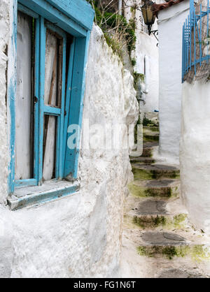 white painted narrow passageway between buildings with a handrail Stock ...