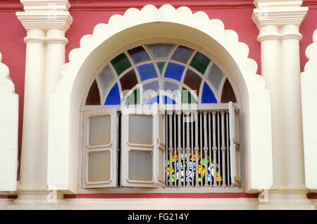Carved window with stained glass Goa Maharashtra India Asia September ...