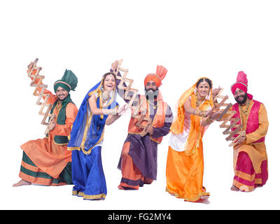 Dancers playing musical instrument performing folk dance bhangra MR ...
