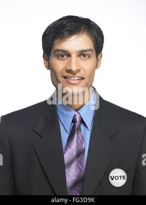 Executive used vote badge on black coat MR Stock Photo - Alamy