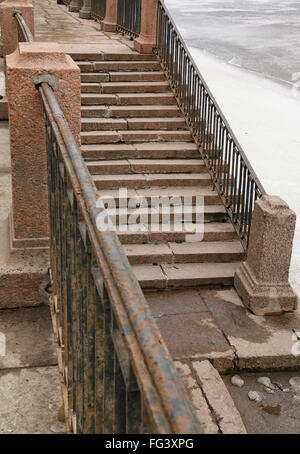 Granite stairs steps at river embankment background. City construction ...