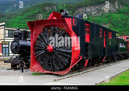 Old snow blower train at Skagway Alaska and trees in the background ...