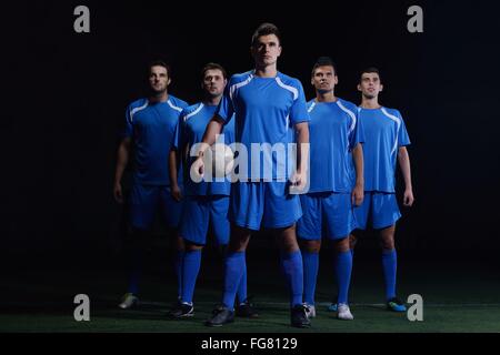 soccer players team group isolated on black background Stock Photo - Alamy