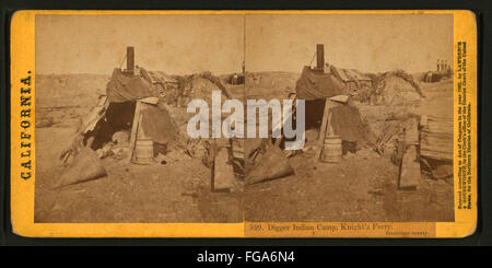 This photograph depicts a Digger Indian camp, capturing daily life and ...