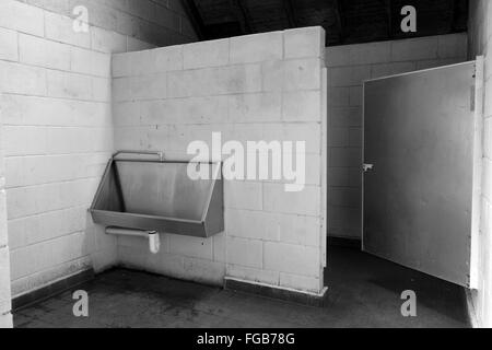 A utilitarian public mens stainless steel urinal trough 18th February ...