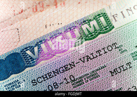 Schengen visa stamp in international passport. Shengen document for ...