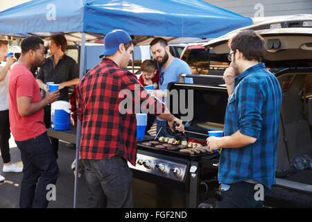 Group Of Sports Fans Tailgating In Stadium Car Park Stock Photo - Alamy