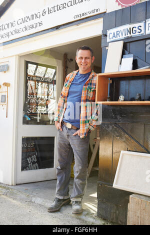 Portrait Of Stone Mason Standing Outside Workshop Stock Photo - Alamy