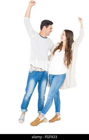 Triumphant couple raising fist Stock Photo - Alamy