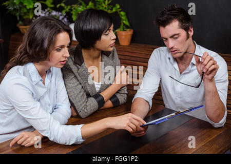 Friends discussing about the menu Stock Photo - Alamy