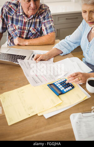 Senior couple checking their bills Stock Photo - Alamy