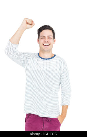 Triumphant man raising fist Stock Photo - Alamy