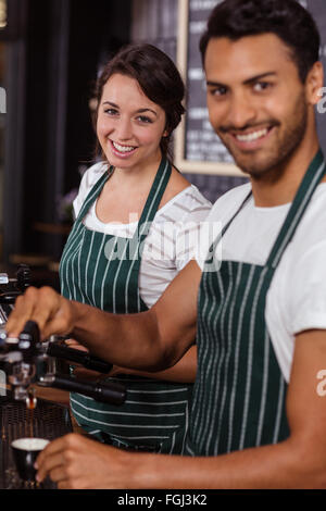 Smiling baristas working Stock Photo - Alamy