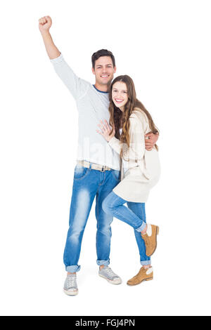 Triumphant couple raising fist Stock Photo - Alamy