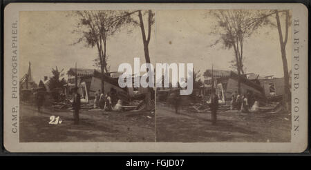 A photograph by Daniel S. Camp showing residents surveying the damage ...