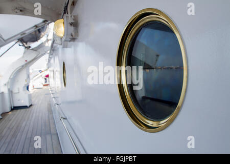 Round porthole on a cruise ship, interior view through the window on ...
