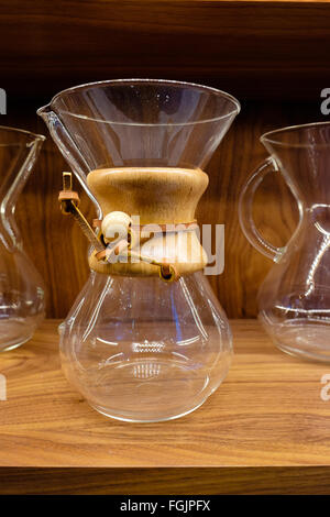Glass pour over coffee maker on ceramic tile. Vertical shot, complete ...