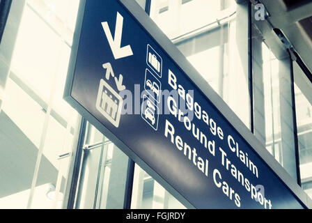 Emergency exit sign at airport, Terminal 5, Heathrow airport, London ...