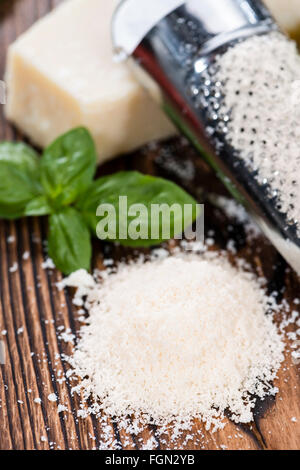 Heap of grated Parmesan (close-up shot) on wooden background Stock ...