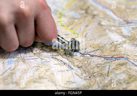 Map measuring tool called a curivmeter or opisometer. Wheel on a ...