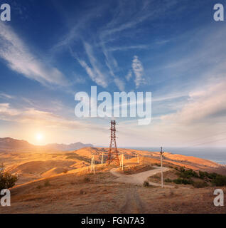 High voltage power tower in majestic Chimgan mountains. Concept ...