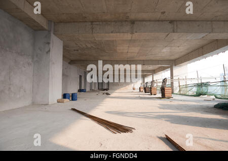 A cement structure inside an unfinished building Stock Photo - Alamy