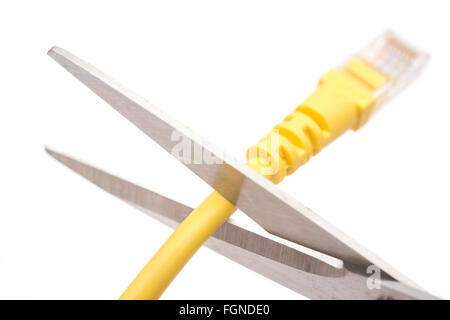 Scissors cutting the yellow network cable. Prohibit and restrict access ...