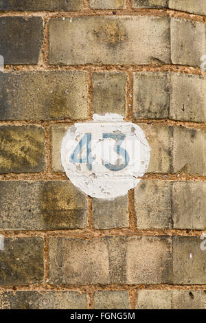 faded hand painted house number 4 sign on gate Stock Photo - Alamy