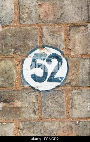 House number 52 on a white wall Stock Photo - Alamy