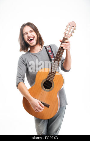 Young bristle man laughing while playing video game with joystick ...