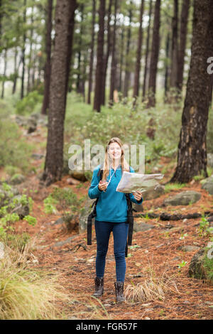Female hiker using map and compass Stock Photo - Alamy