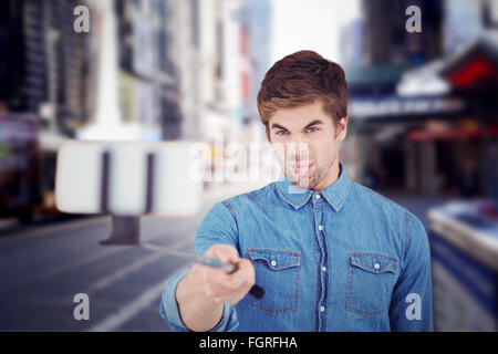 Young hipster man sticking tongue out happy with funny expression ...