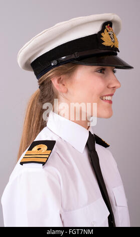 Female navy officer in uniform of a Lt Commander wearing a hat and ...