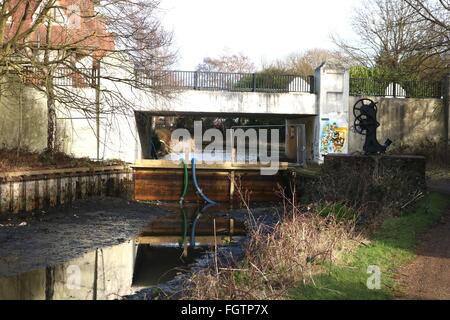 The Basingstoke Canal at Woking, Surrey, drained ready for repair works ...