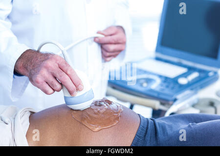 Doctor applying ultrasound gel on belly of woman Stock Photo: 88007589 ...