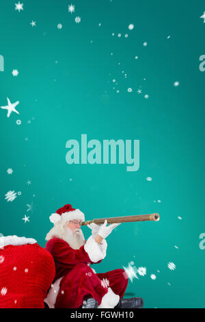 Santa claus looking through telescope against red background Stock ...