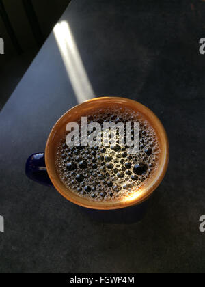 Foaming mug of coffee Stock Photo - Alamy