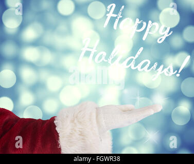 Composite image of santa claus shows open hand Stock Photo - Alamy