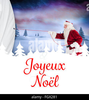 Composite image of santa claus pulling rope Stock Photo - Alamy