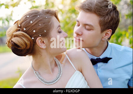 A couple of the bride and groom flirting with each other. Action ...