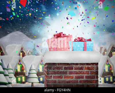 Composite image of chimney filled with gift Stock Photo - Alamy
